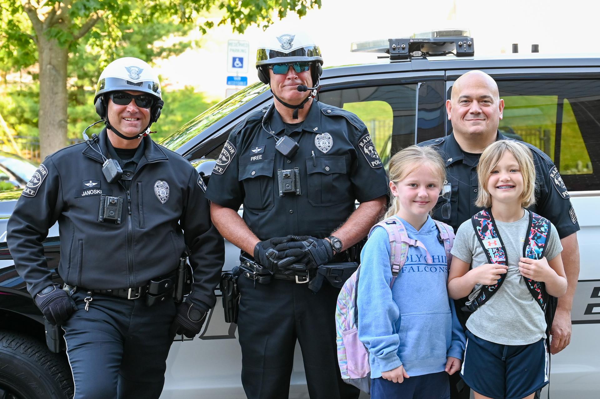 Spring Auction Experience — Arriving to School in a Cop Car!