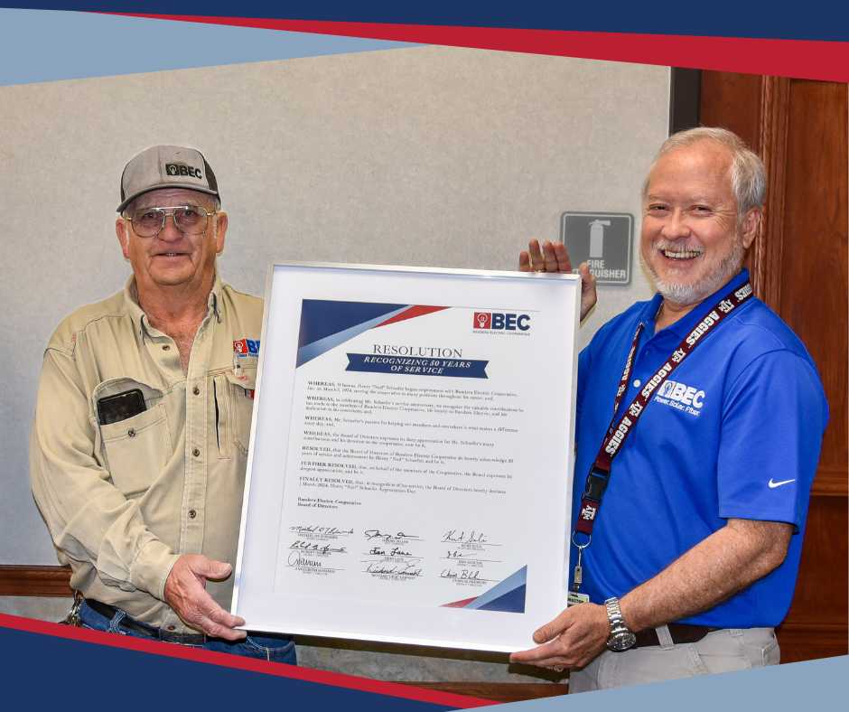 Henry receives large framed commendation from BEC